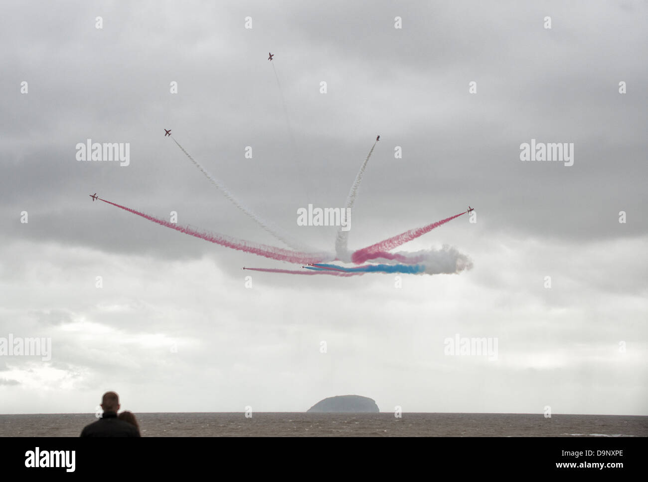 The Red Arrows break formation during their exciting aerobatic display ...