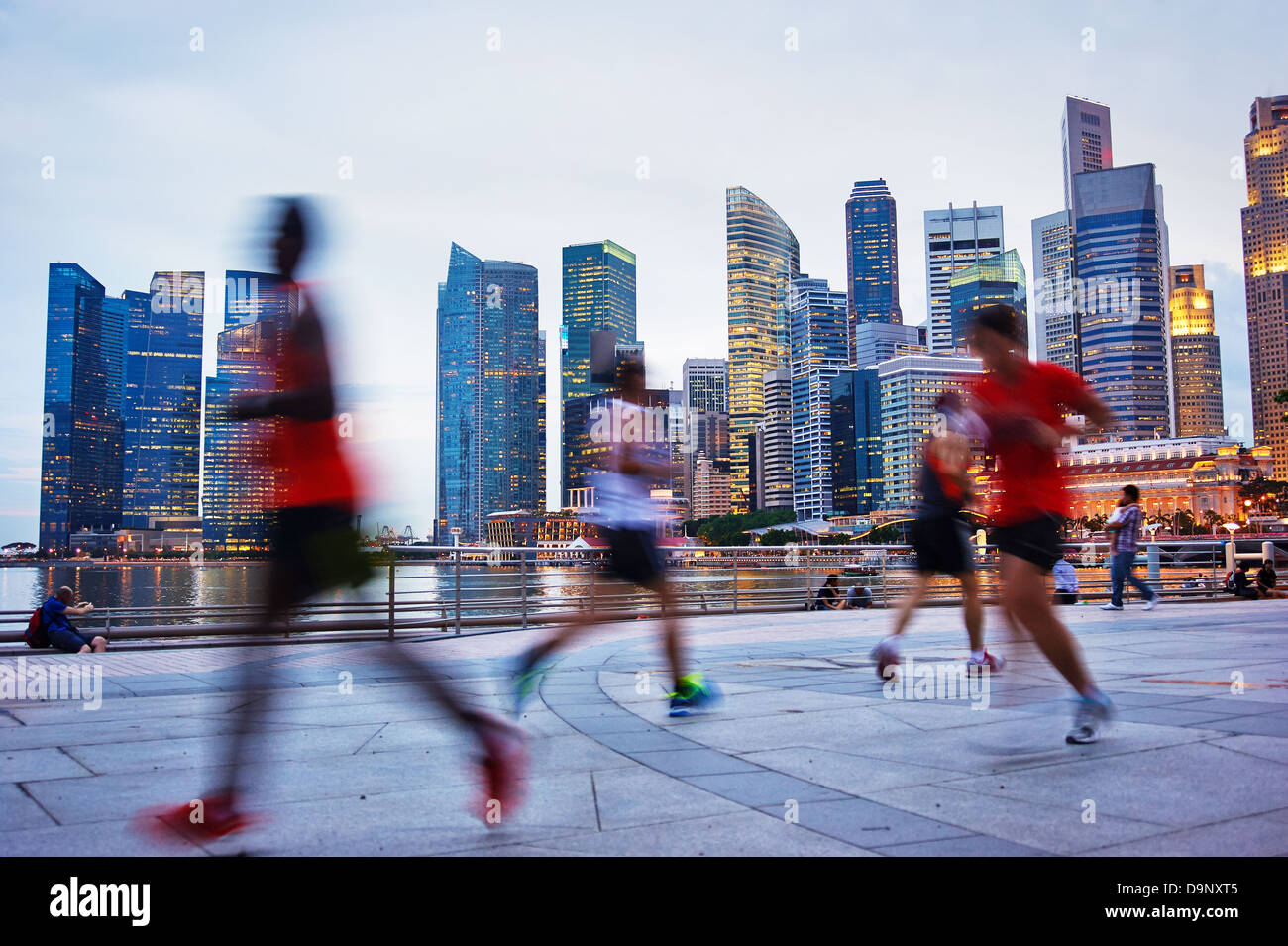 People running in the evening in Singapore Stock Photo - Alamy