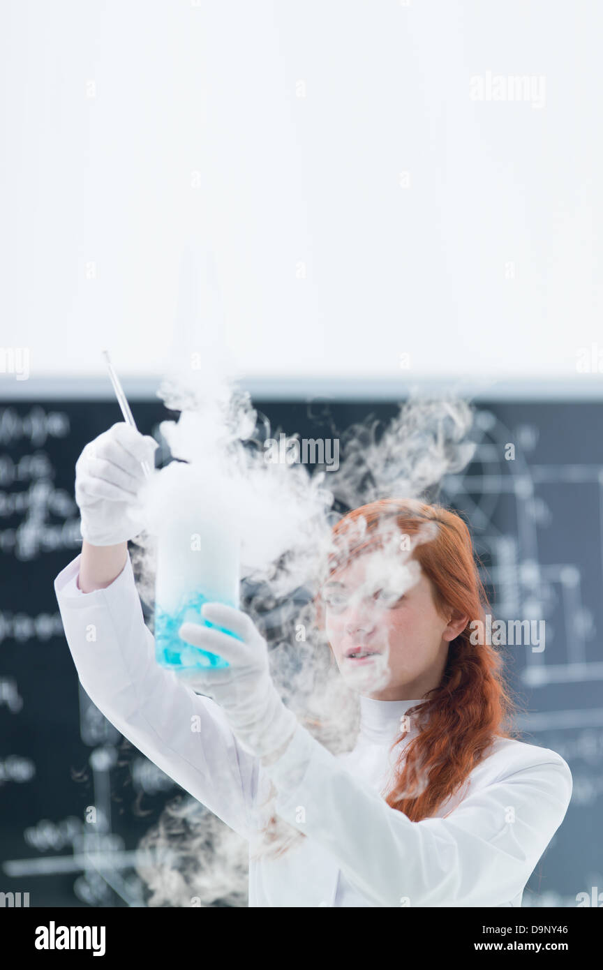 general-view of a student in a chemistry lab conducting an experiment ...
