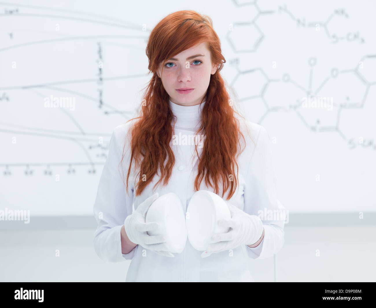 general-view of a pretty student portrait in a chemistry lab looking in ...