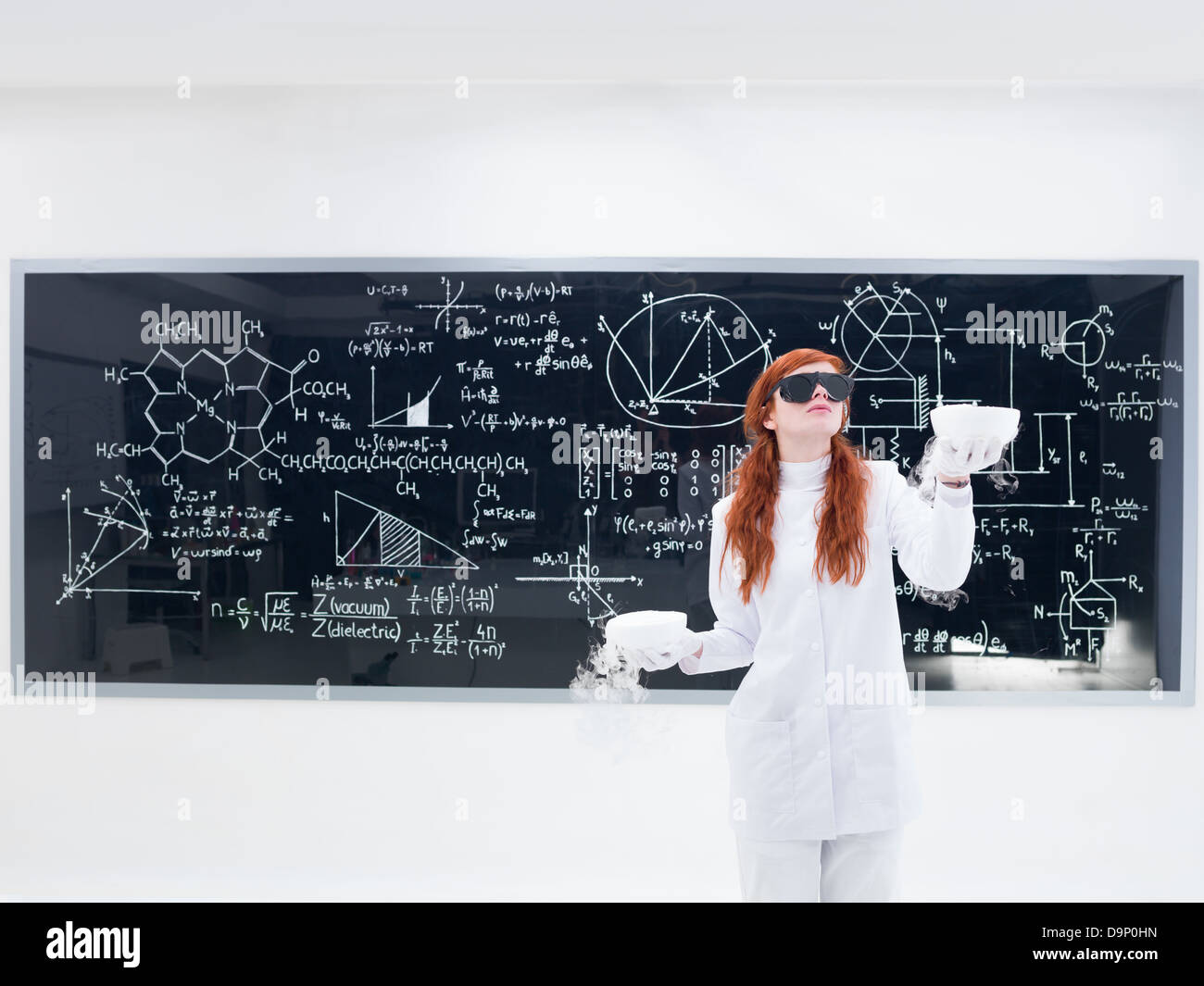 general-view of a pretty girl student in a chemistry lab wearing black ...