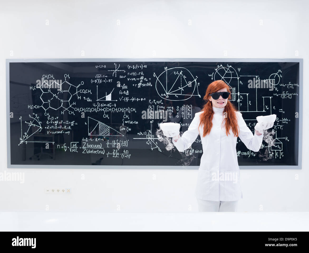 general-view of a pretty girl student in a chemistry lab wearing black ...