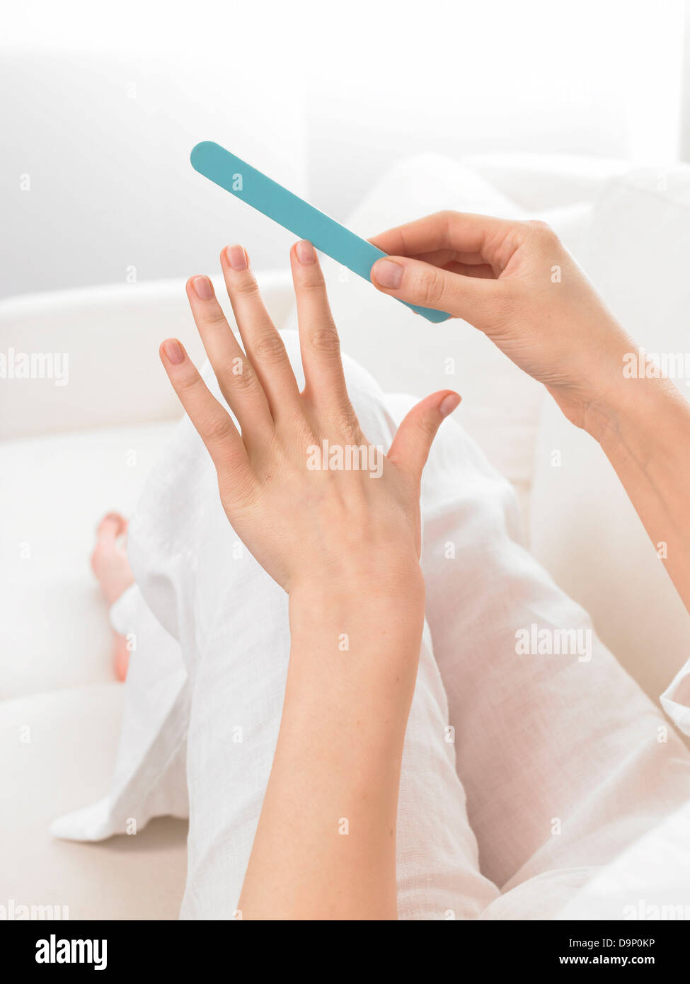 Filing finger nails Stock Photo - Alamy