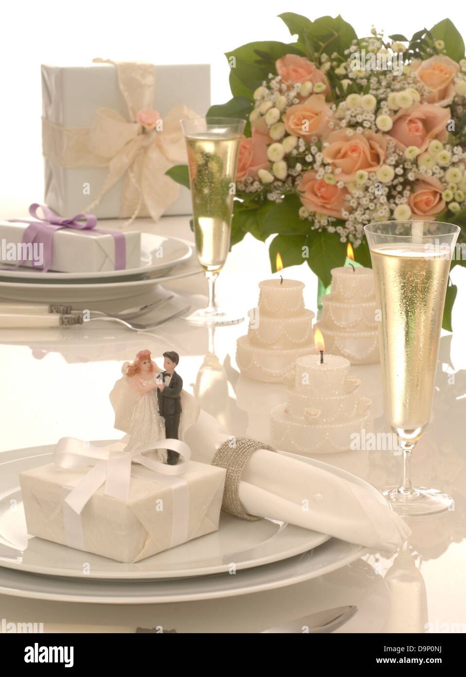Wedding desk with bridal couple and a gift Stock Photo - Alamy