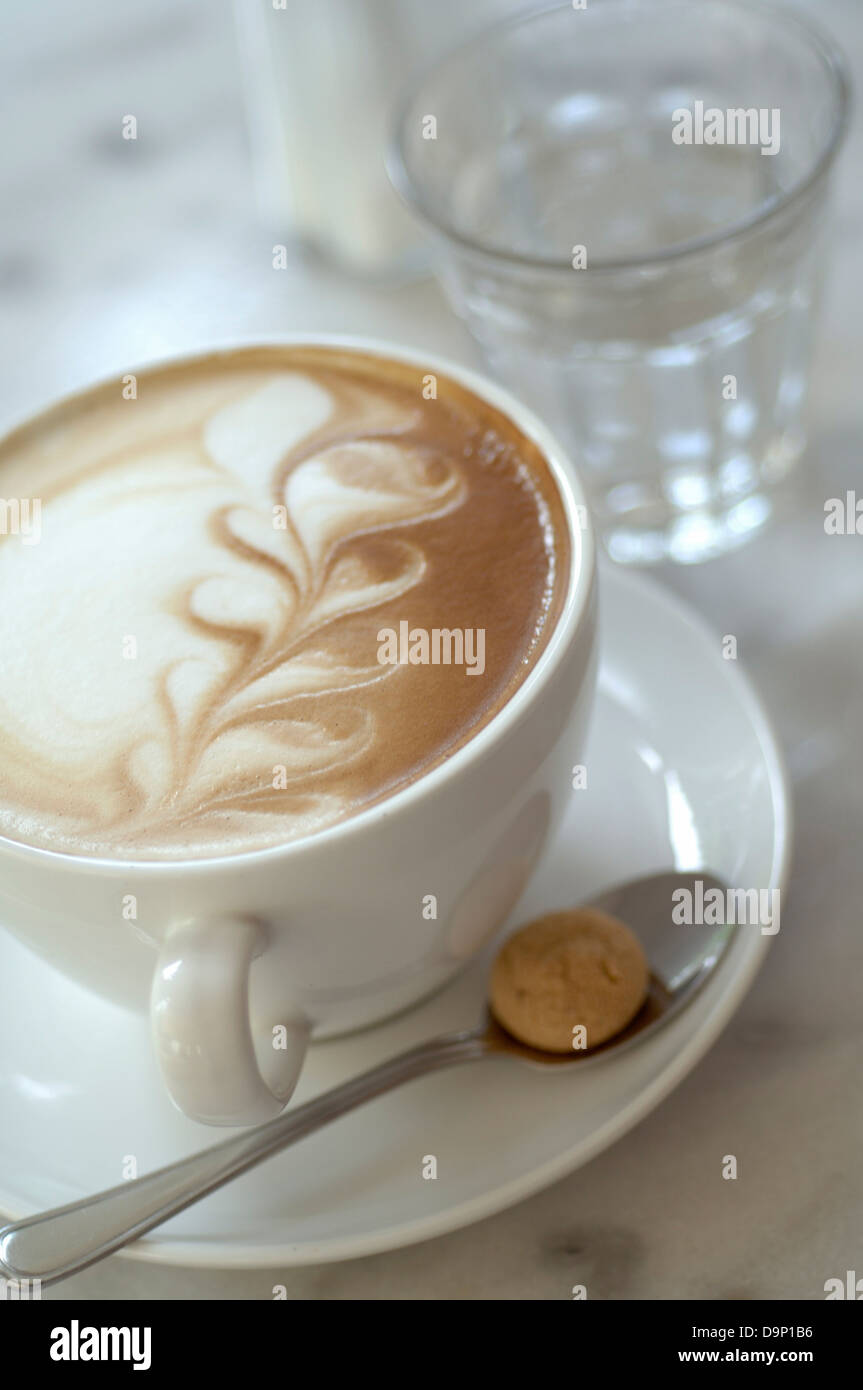A cup of white coffee with nice pattern Stock Photo - Alamy
