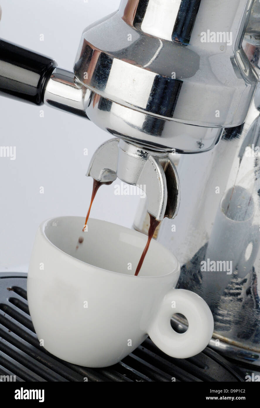 Espresso flowing into a cup Stock Photo - Alamy