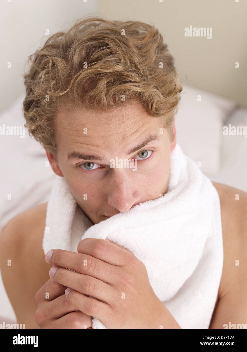 young man with a towel Stock Photo - Alamy