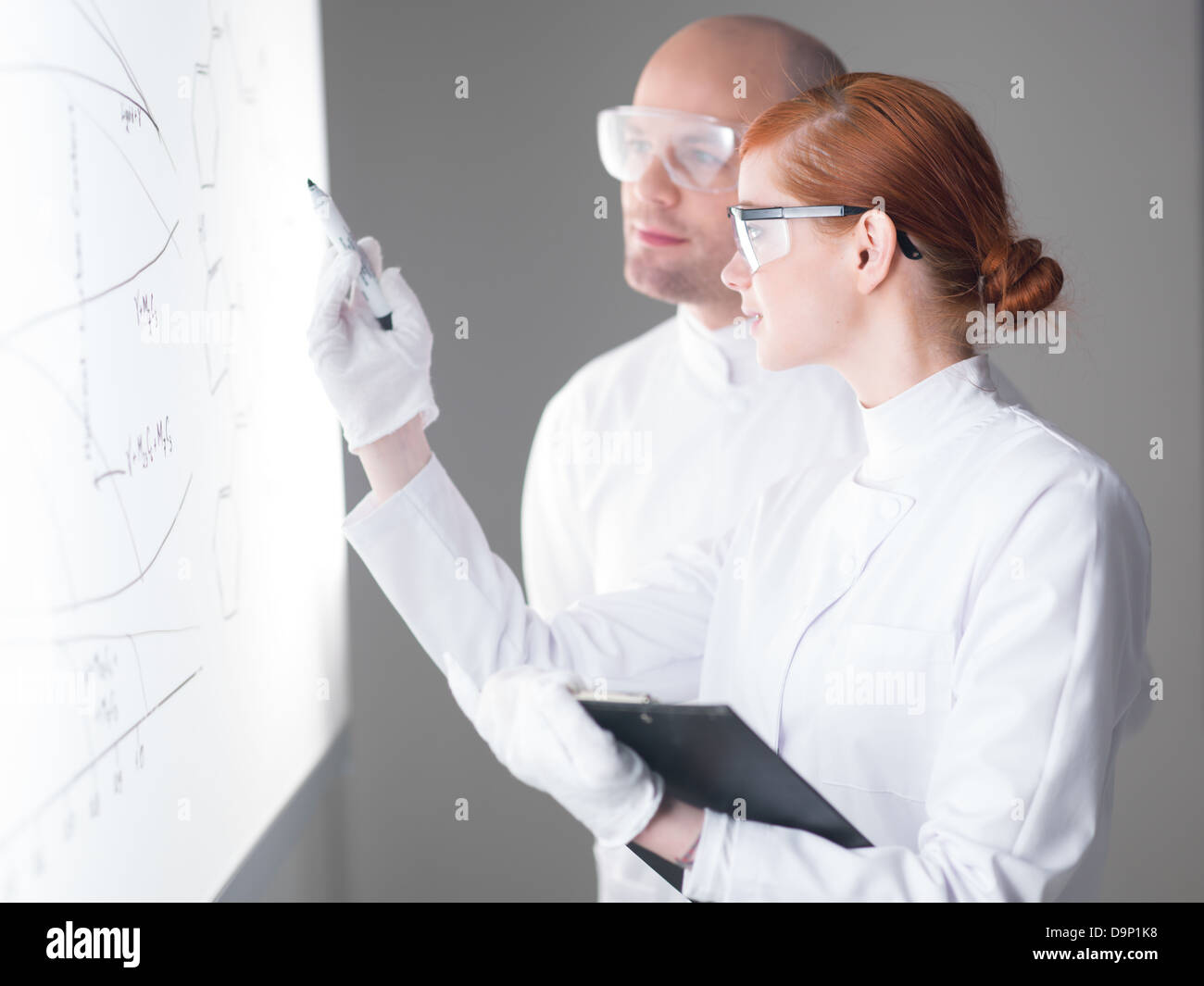 Teacher pointing board classroom hi-res stock photography and images ...