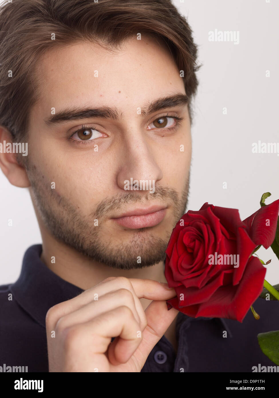 Man with red rose Stock Photo - Alamy