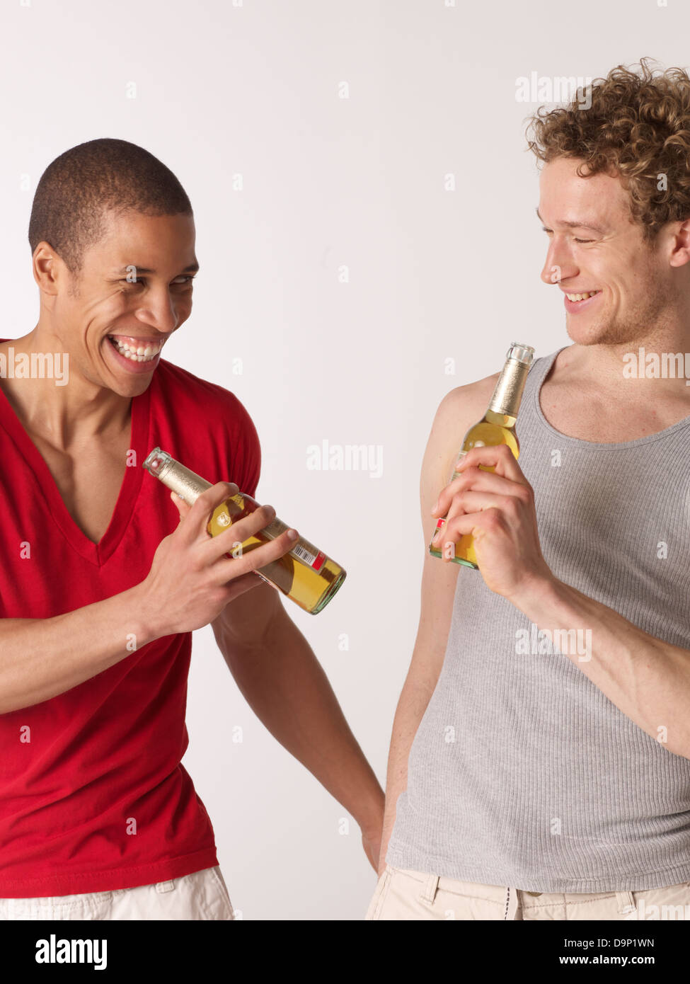 Two friends drinking beer together Stock Photo - Alamy