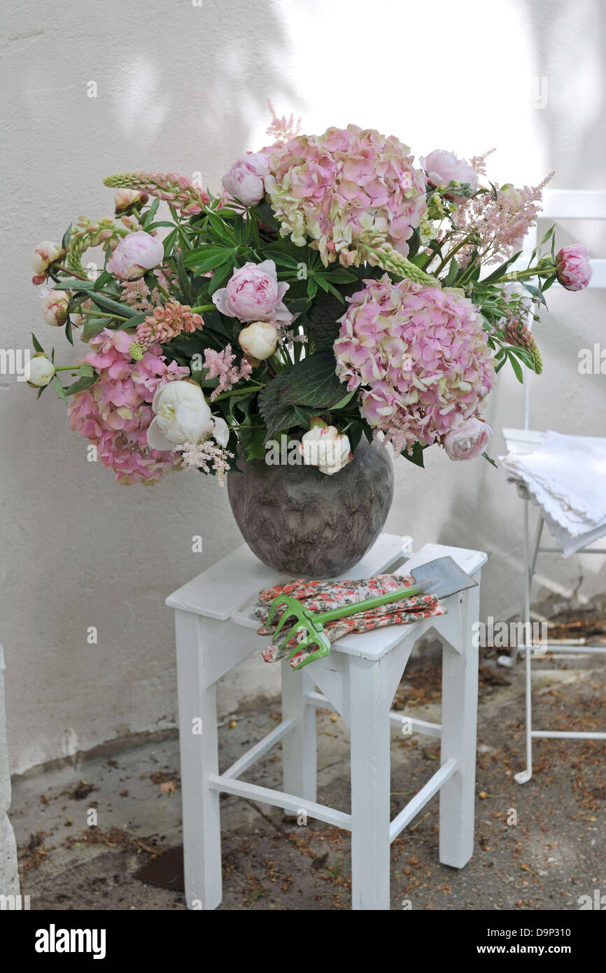 Bunch of flowers on stool Stock Photo - Alamy