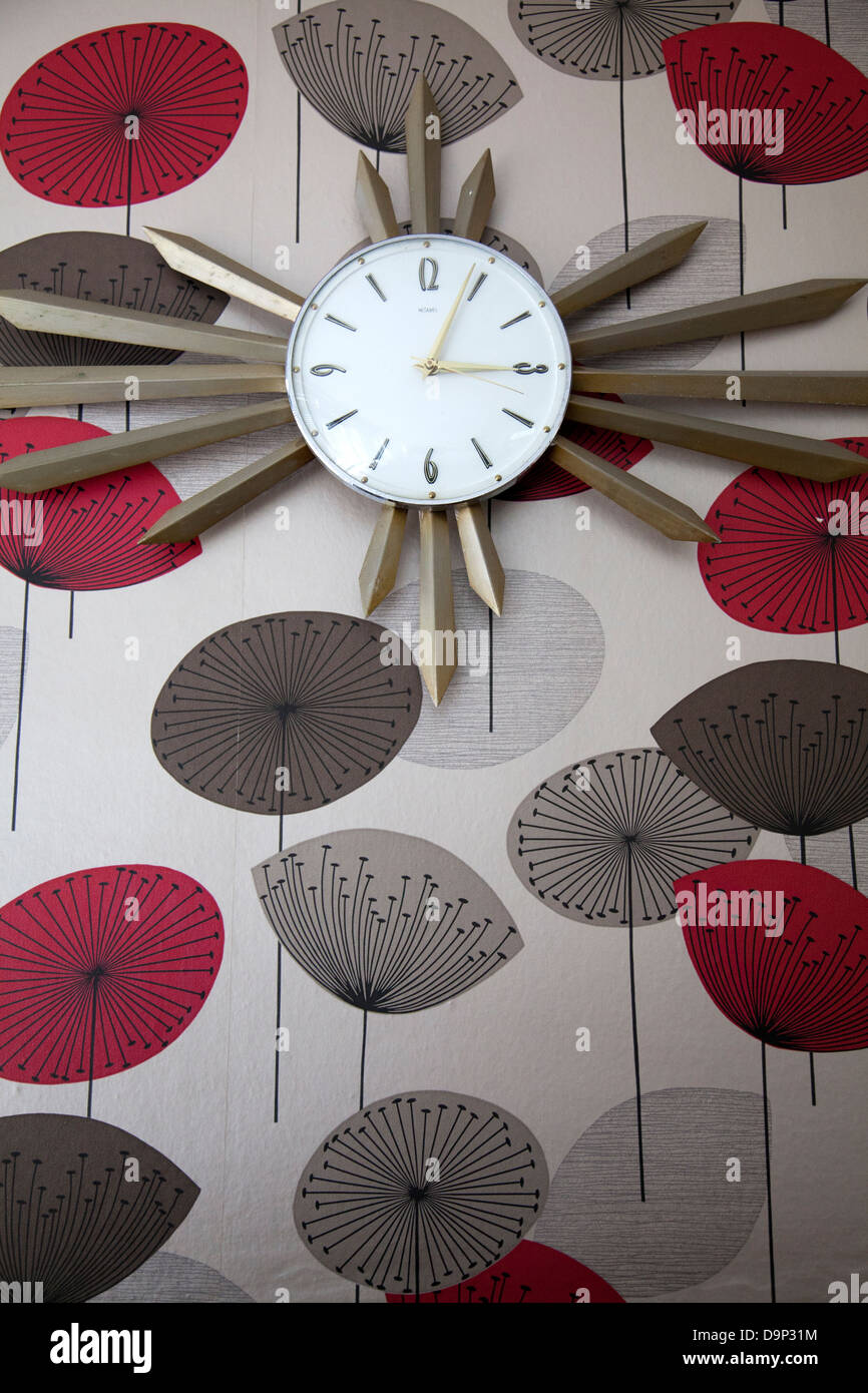 Retro Clock on wallpaper in Interior Stock Photo - Alamy