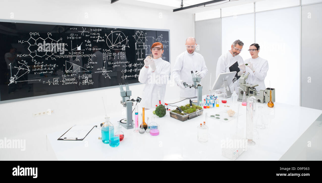 general-view of students in a chemistry lab conducting experiments ...