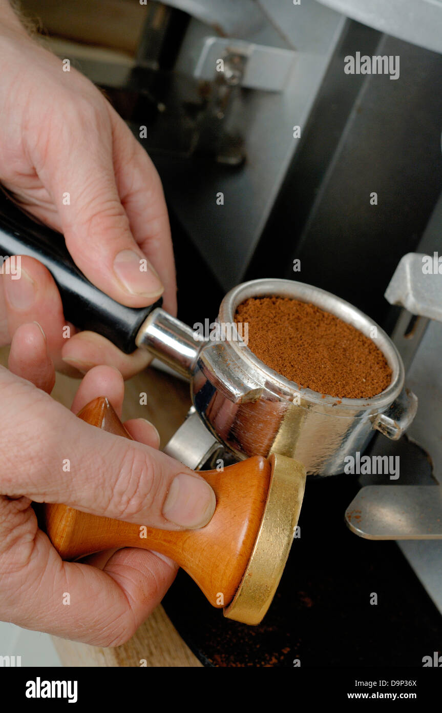 Person using espresso machine Stock Photo - Alamy