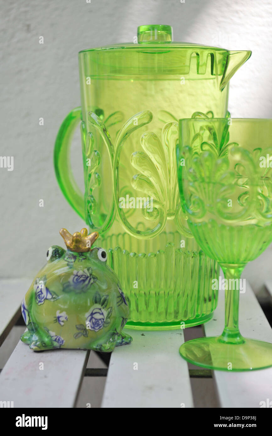 Frog figurine, green pitcher and glass Stock Photo - Alamy