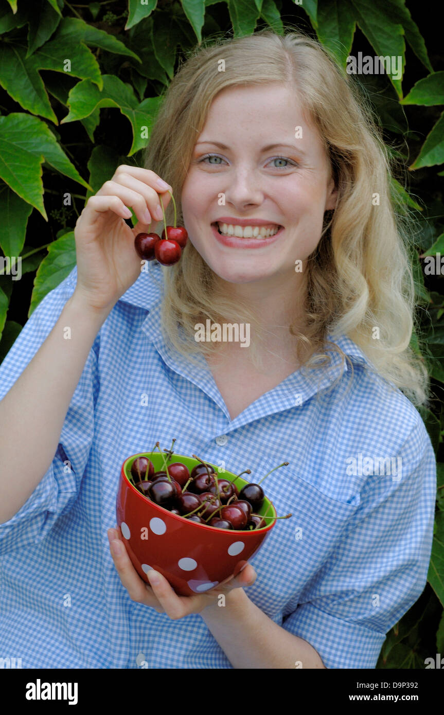 Woman with cherries Stock Photo - Alamy