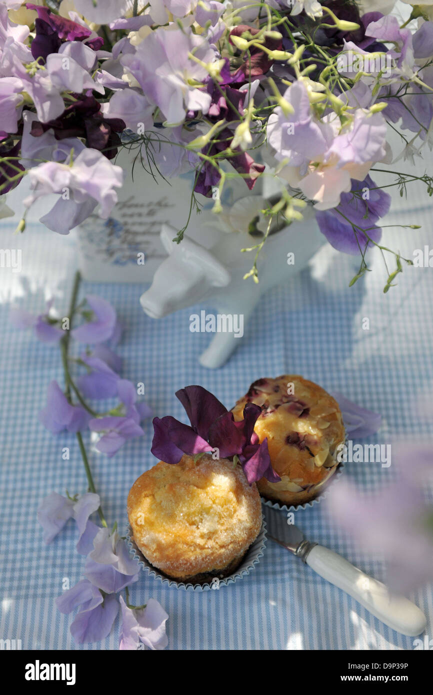 Two muffins and flower Stock Photo - Alamy