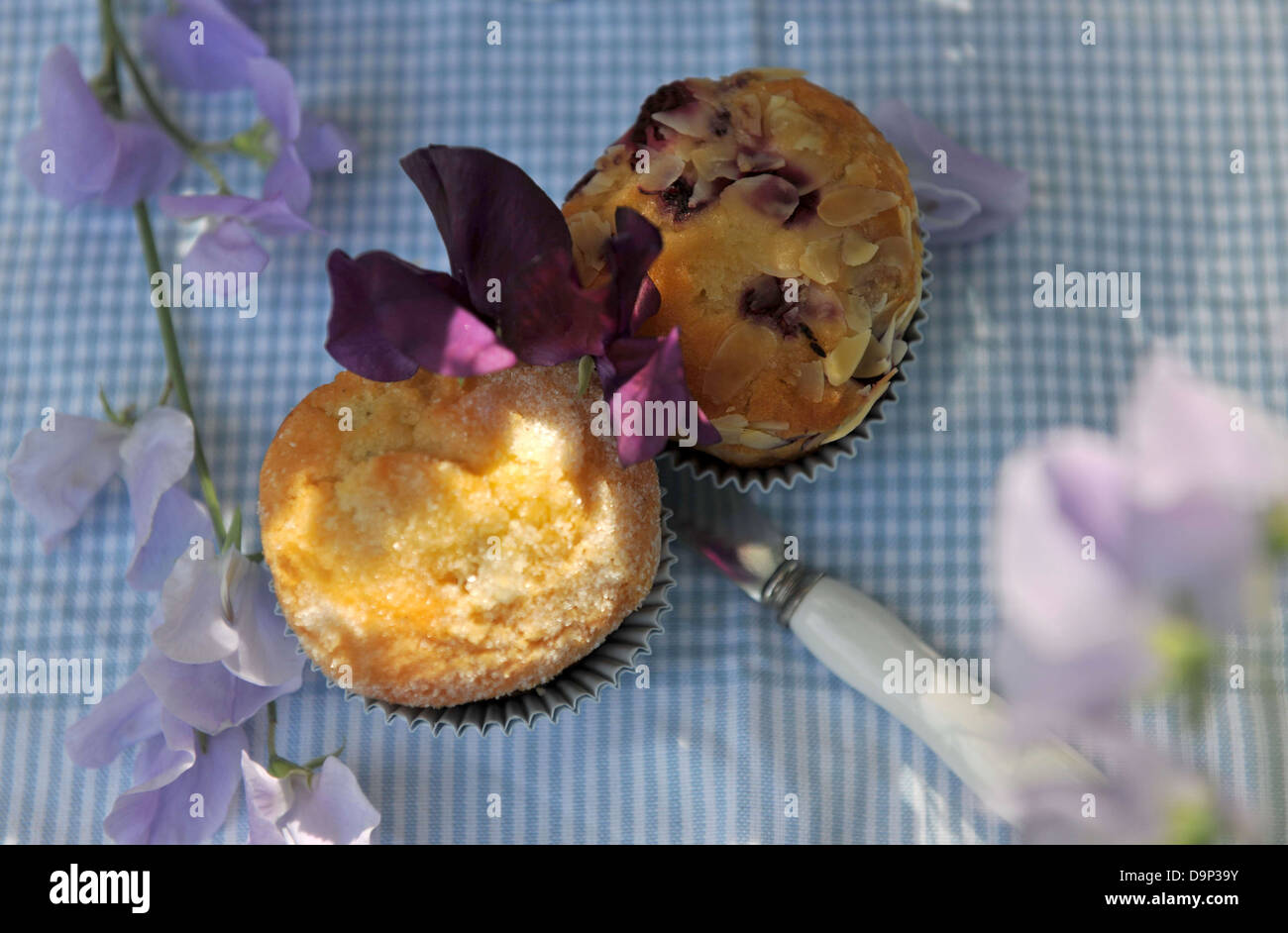 Two muffins and flower Stock Photo - Alamy
