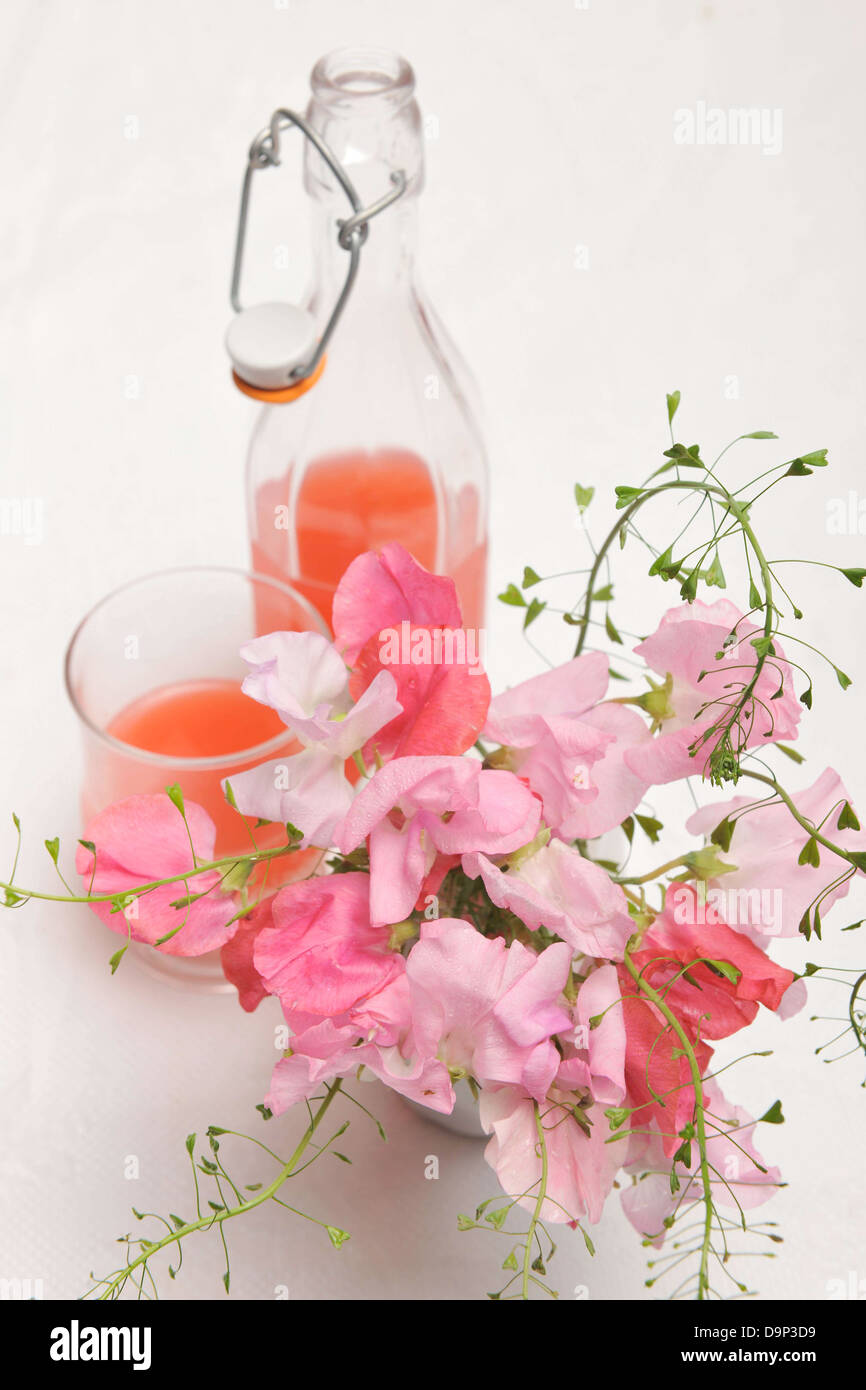 Pink flowers and refreshing drink Stock Photo - Alamy