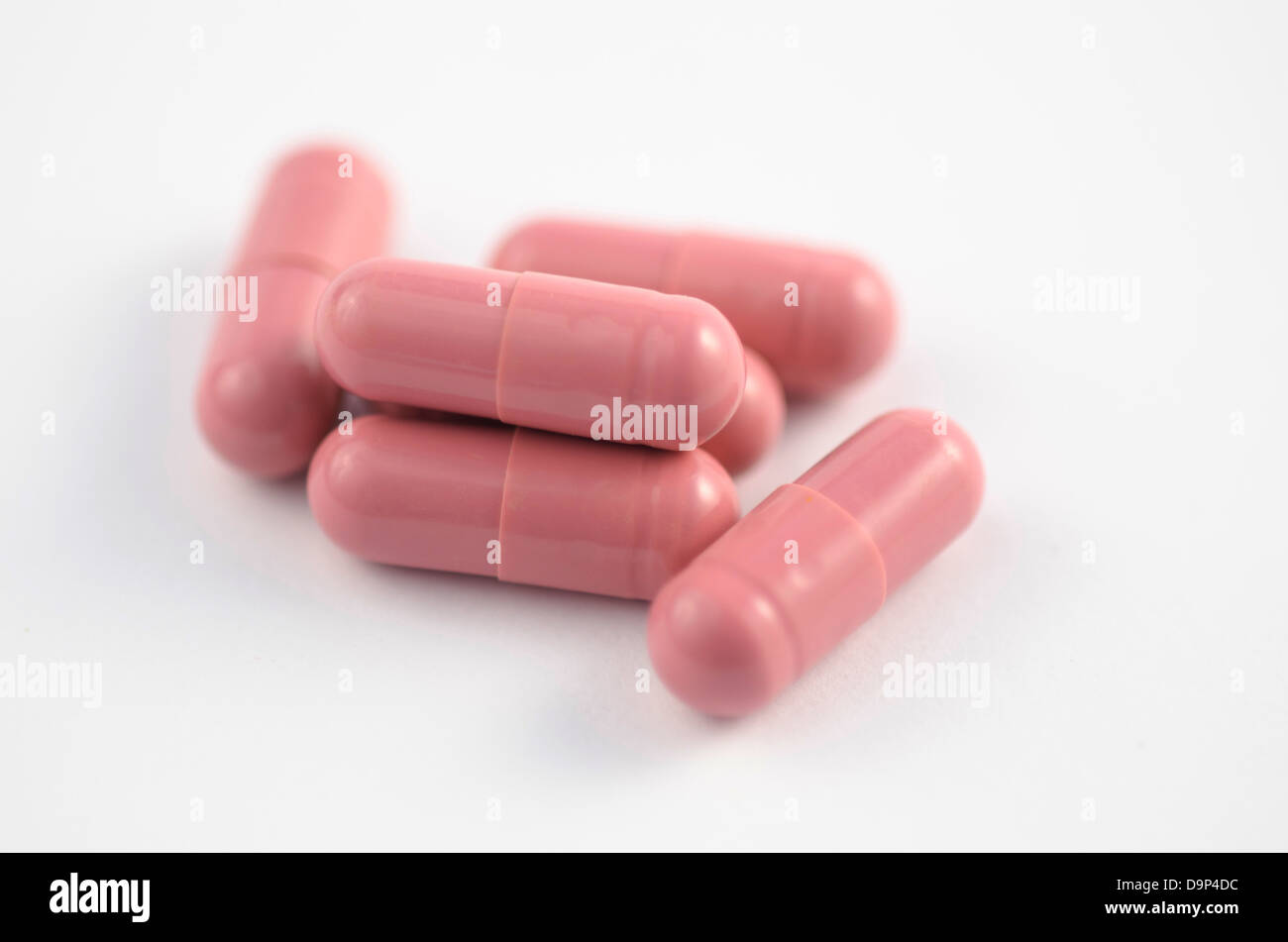 Medical health remedies, a pink capsules medication Stock Photo - Alamy