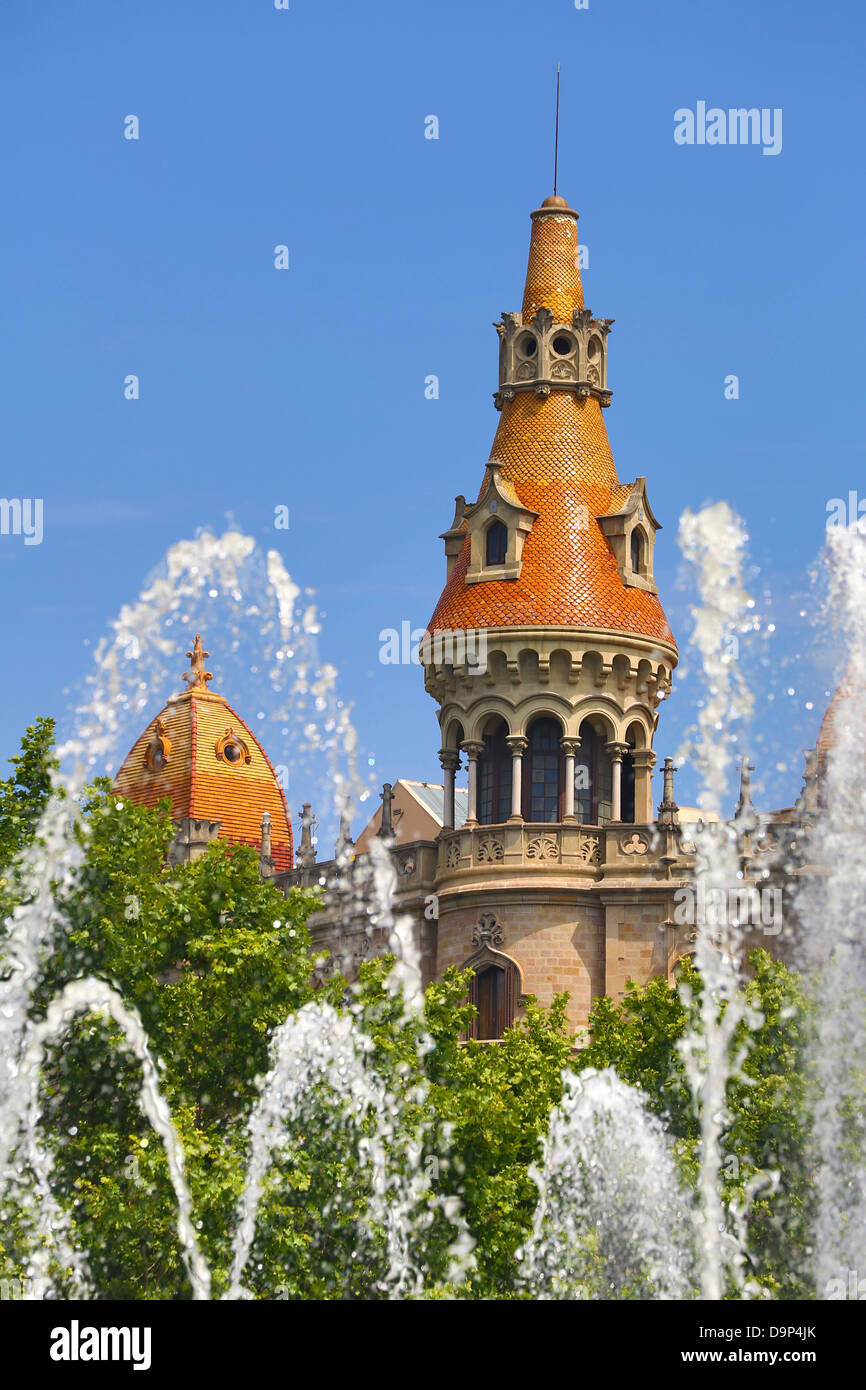 Fountain in the Placa de Catalunya and turret roofs of buildings in the ...