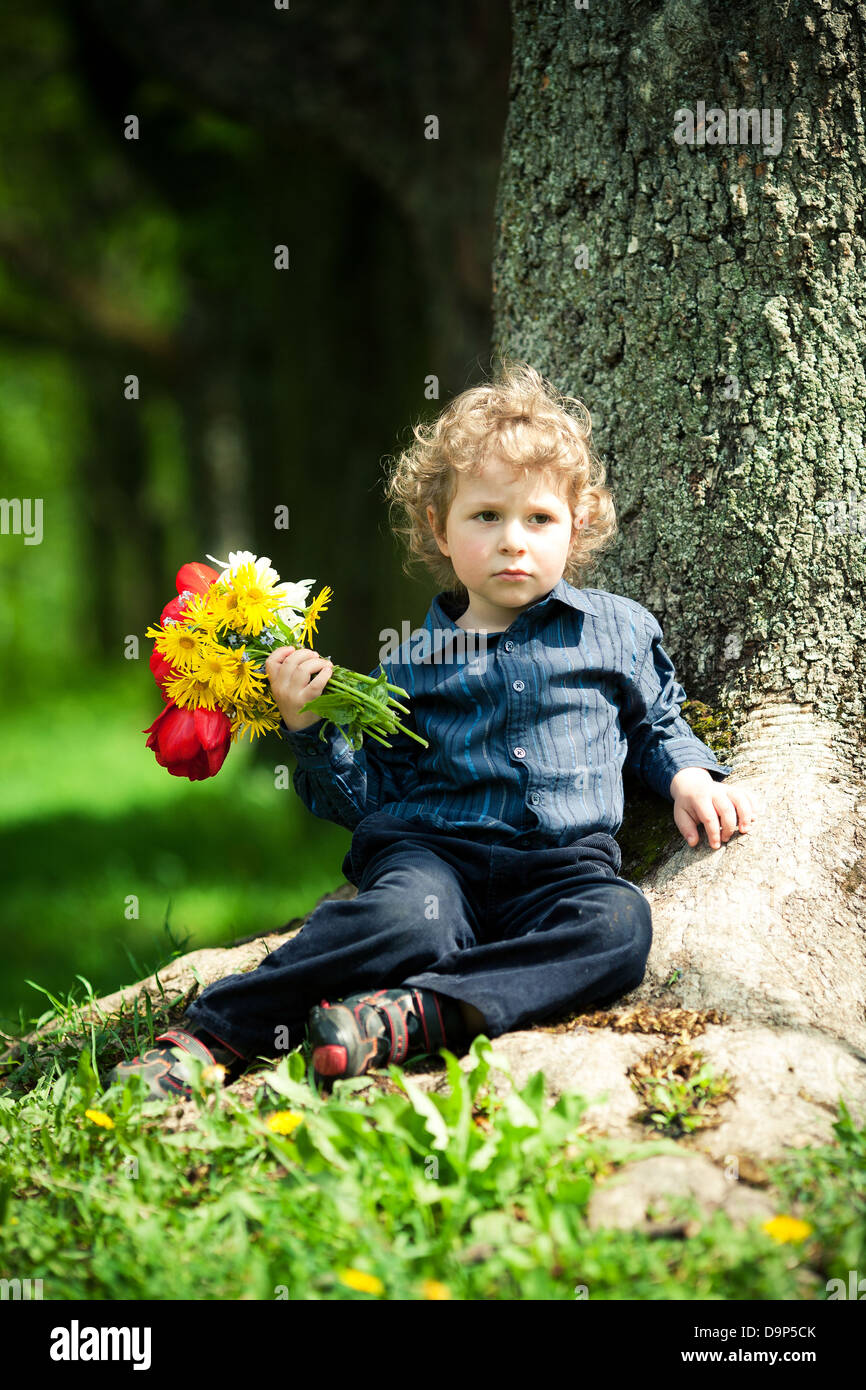 little boy with flowers Stock Photo - Alamy
