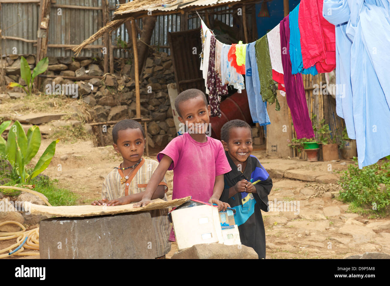 Exclusive: three children pose in front of a camera in Adis Abeba ...
