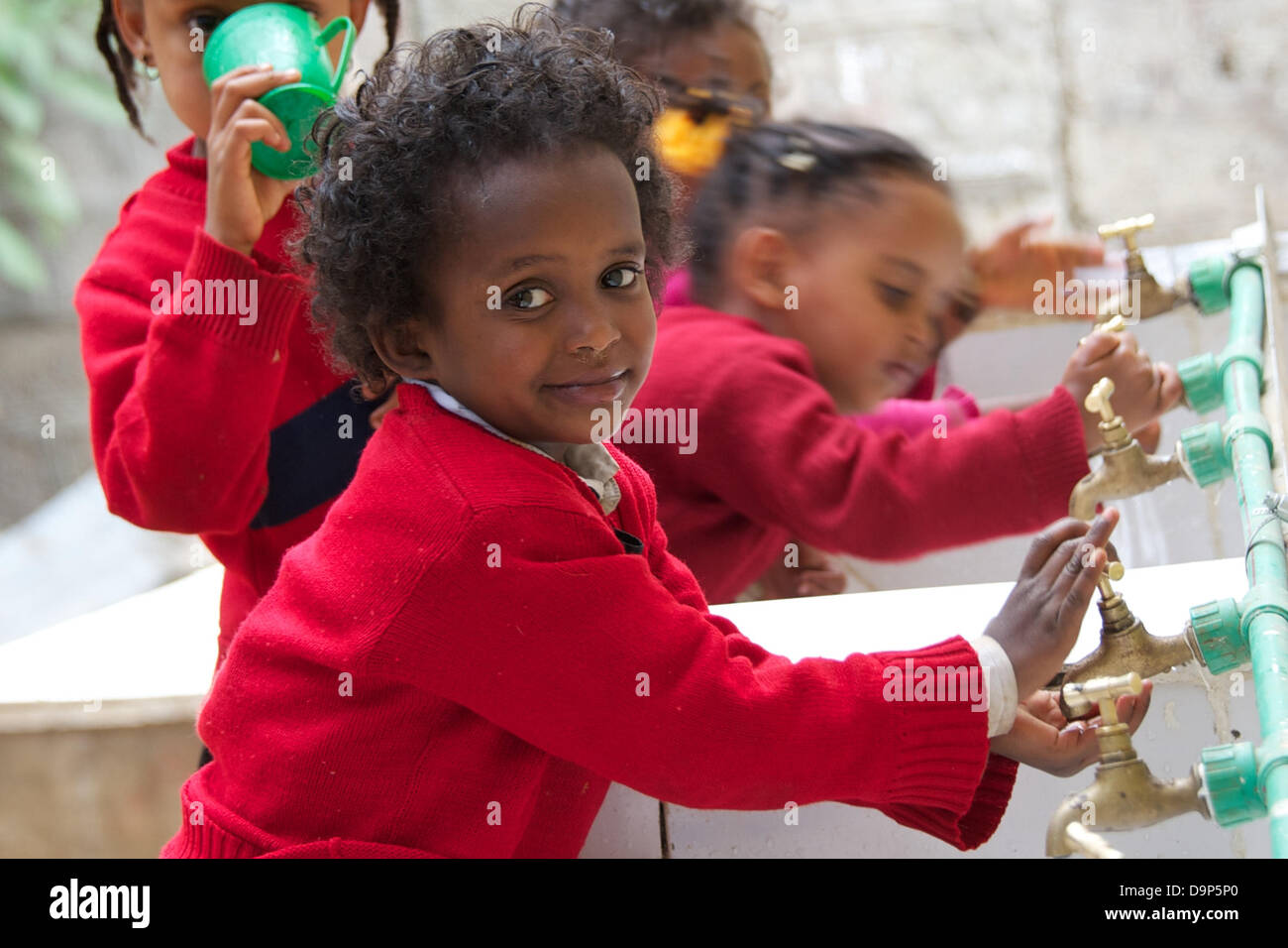 Children playing on taps on 15.03.2013 in a kindergarten in the ...