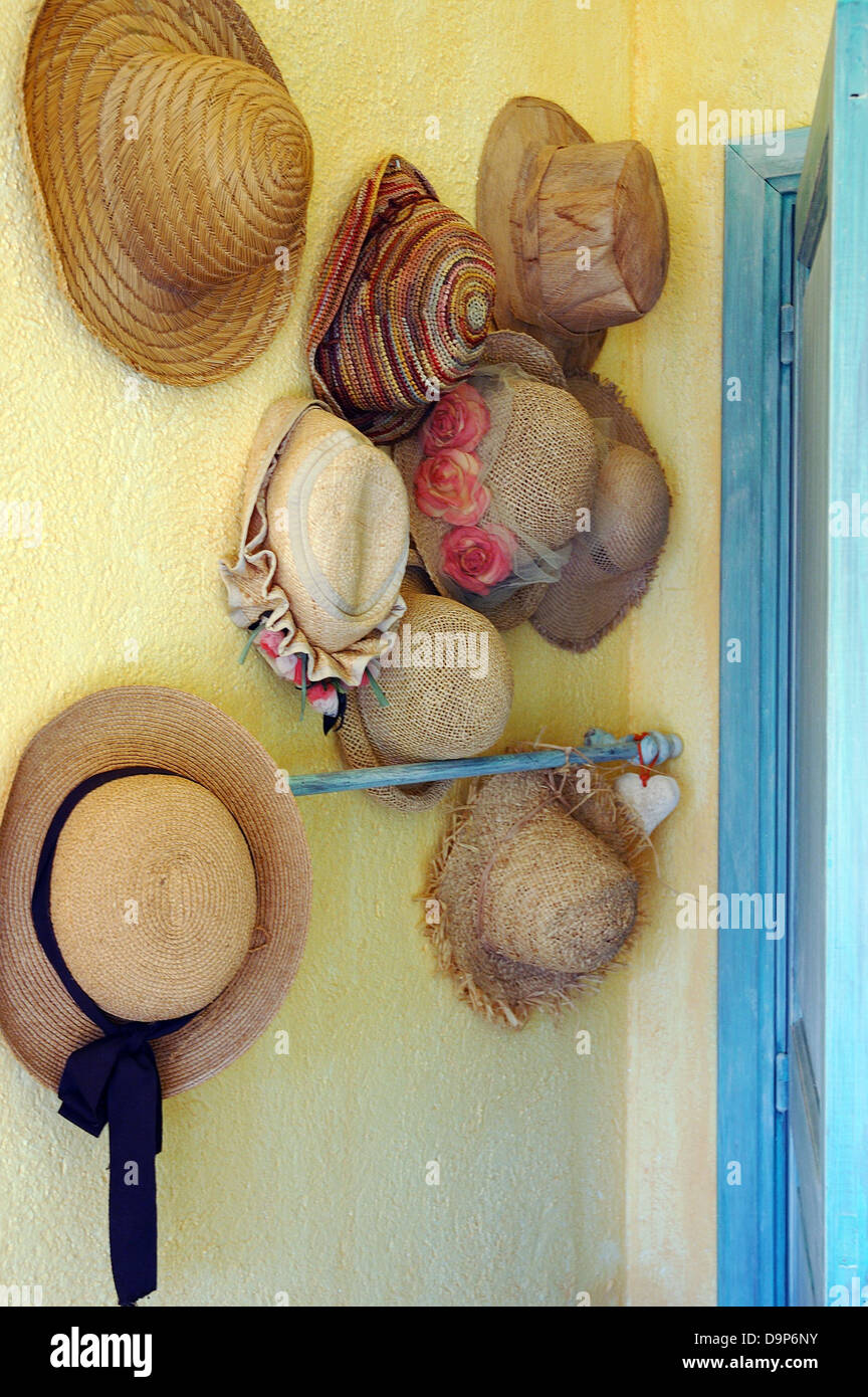 Variety of hats hanging on the wall Stock Photo - Alamy