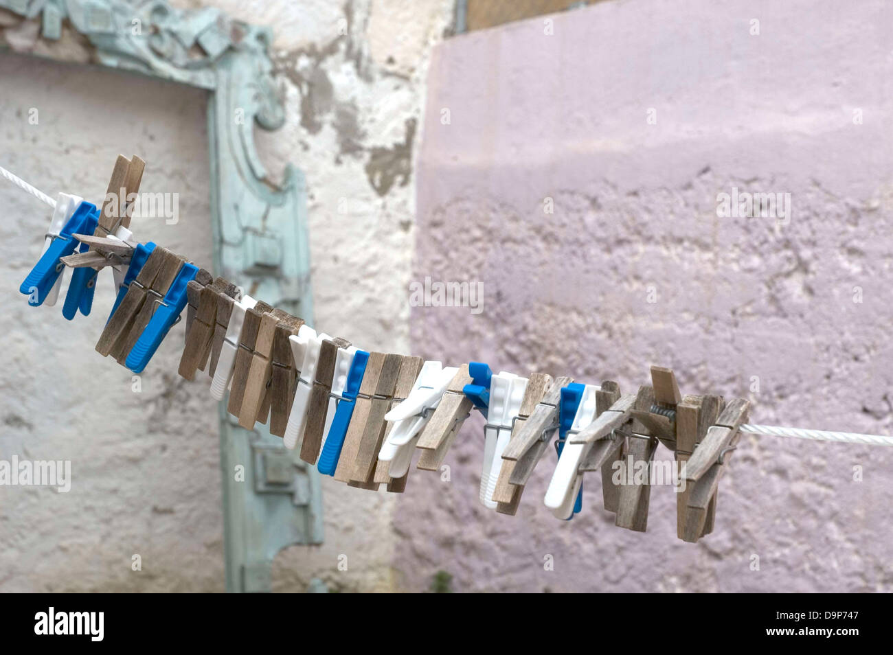 Clothes pegs on clothesline Stock Photo - Alamy