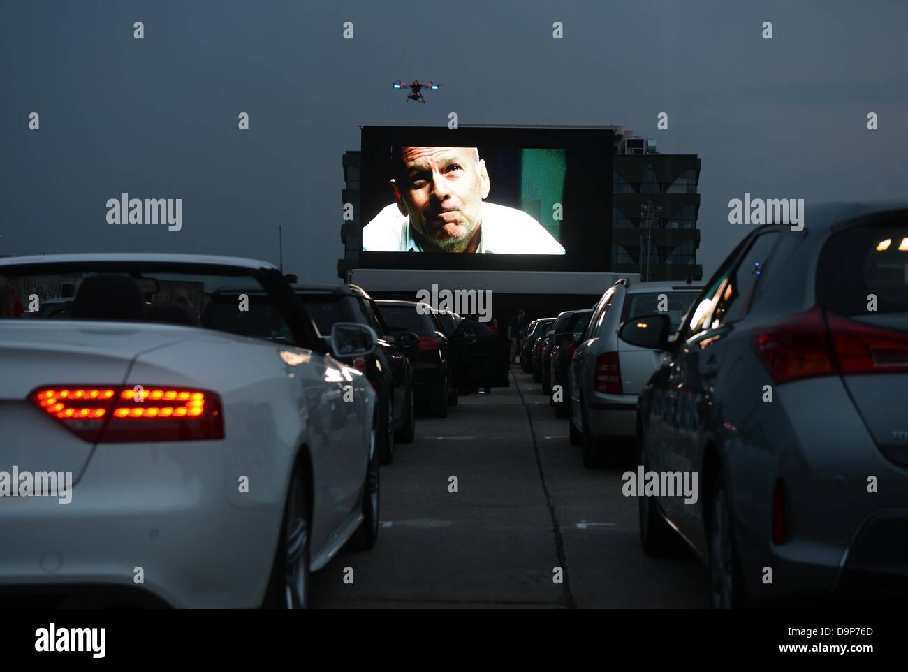 Cars are parked at the drive-in theatre Audi Urban Cinema situated at ...