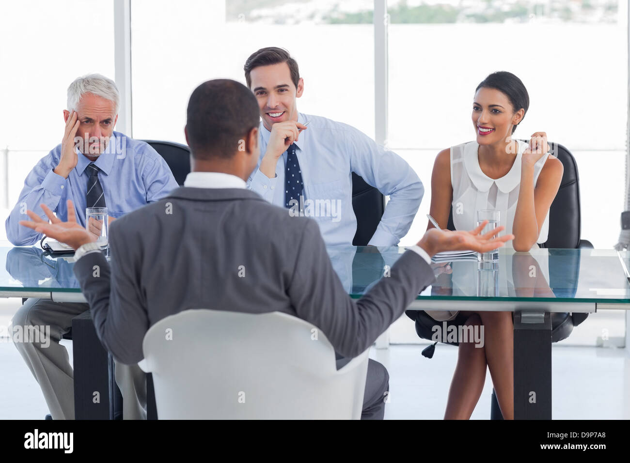 Man gesturing during an interview Stock Photo - Alamy