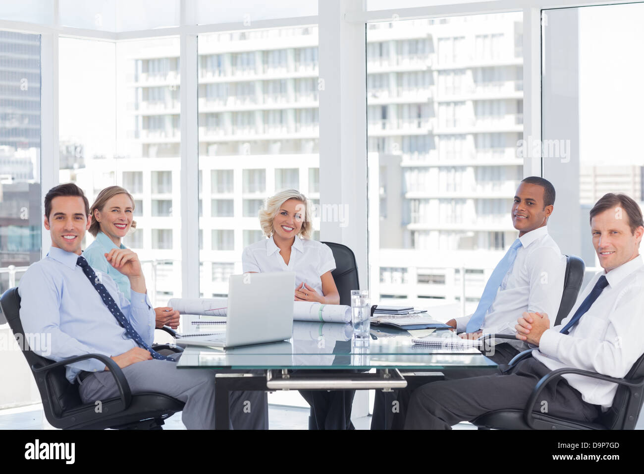Smiling businesswoman looking documents hi-res stock photography and ...