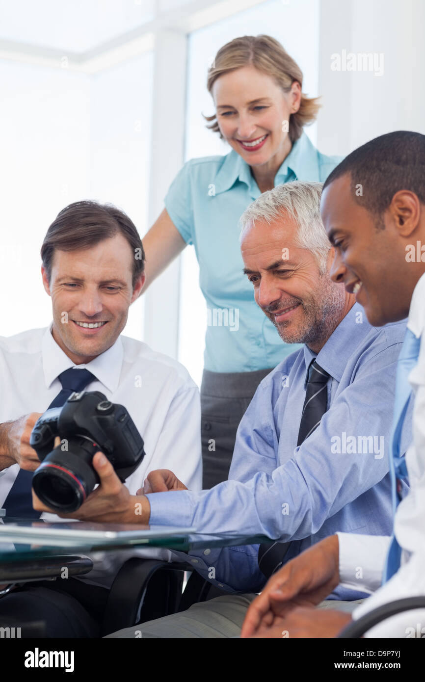 Business people looking at a camera Stock Photo - Alamy