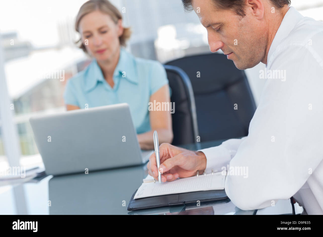 Business man writing hi-res stock photography and images - Alamy
