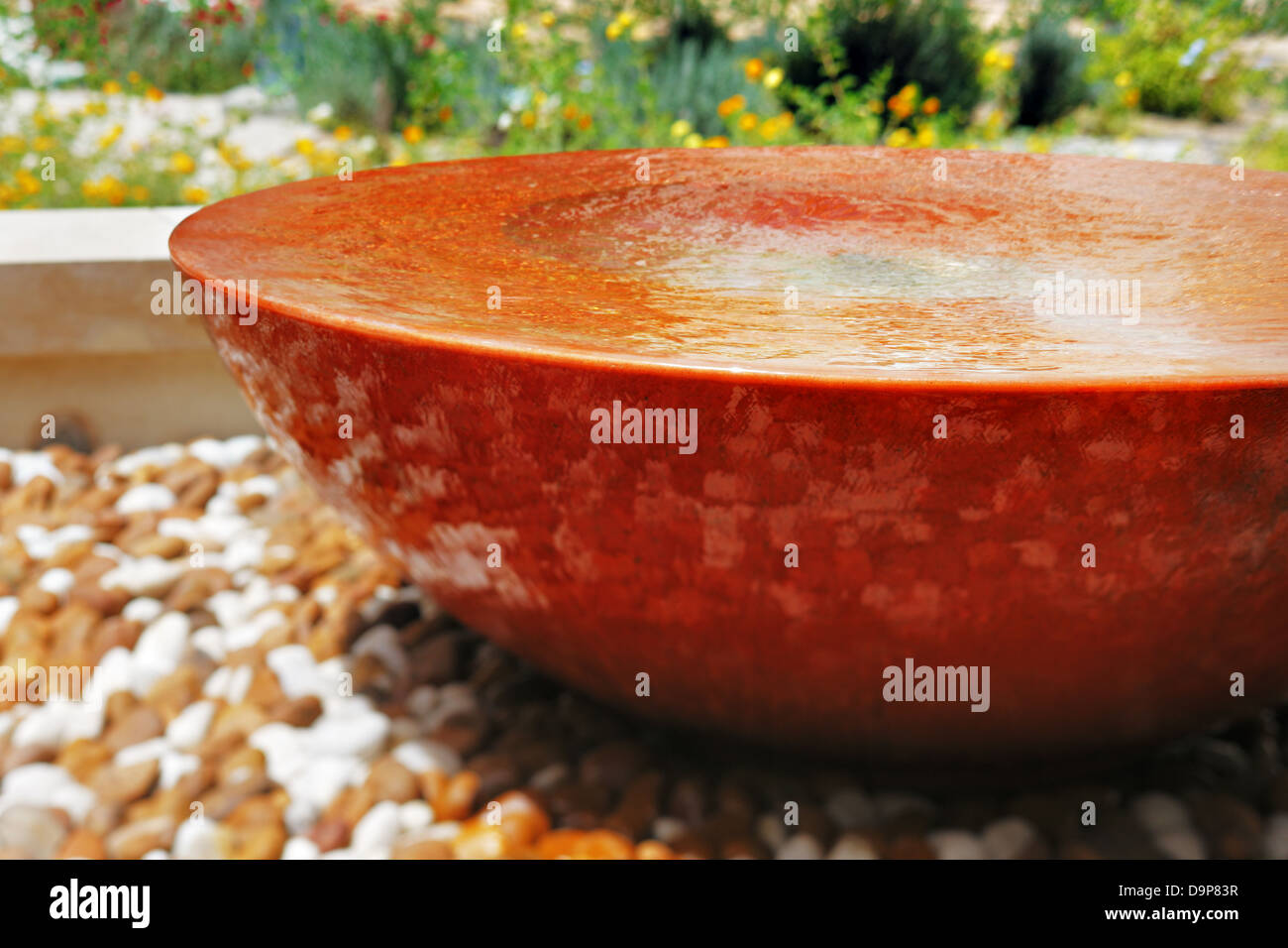 A water fountain provides a beautiful visual piece in any garden and ...