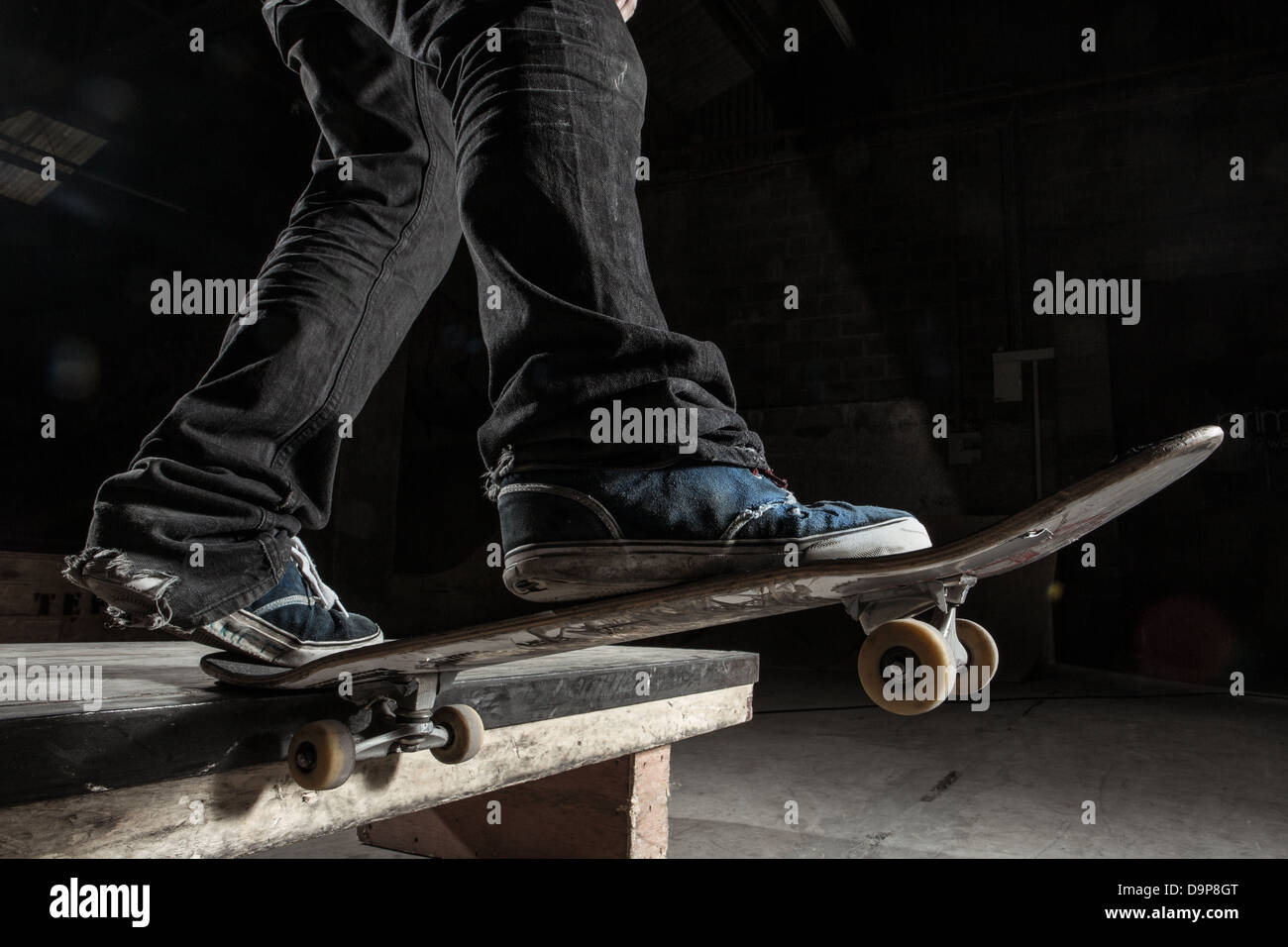 Skater balancing on edge on manual pad Stock Photo - Alamy