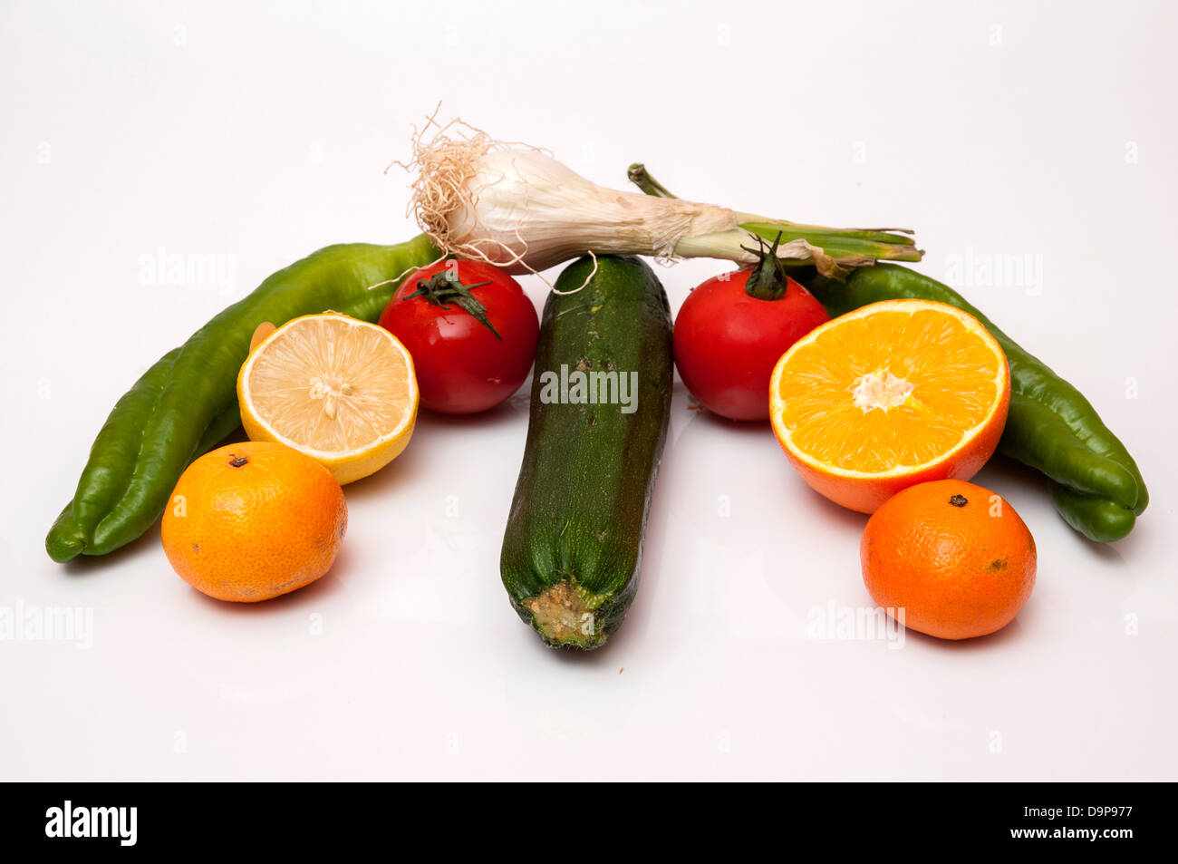 different fruits and vegetables and sweets to eat well Stock Photo - Alamy