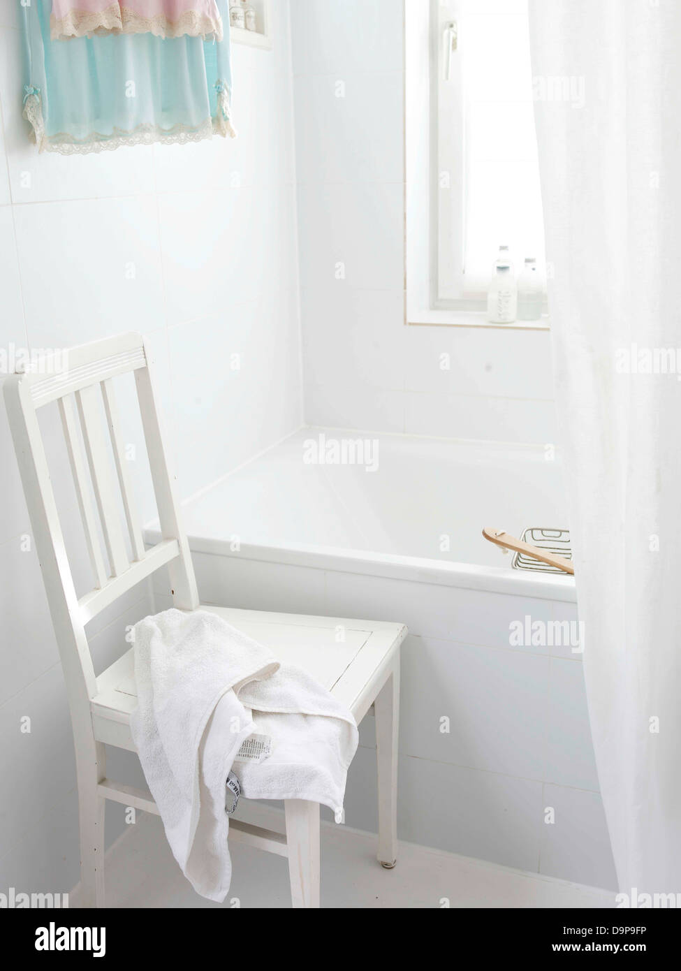 Chair with towel in bathroom Stock Photo - Alamy
