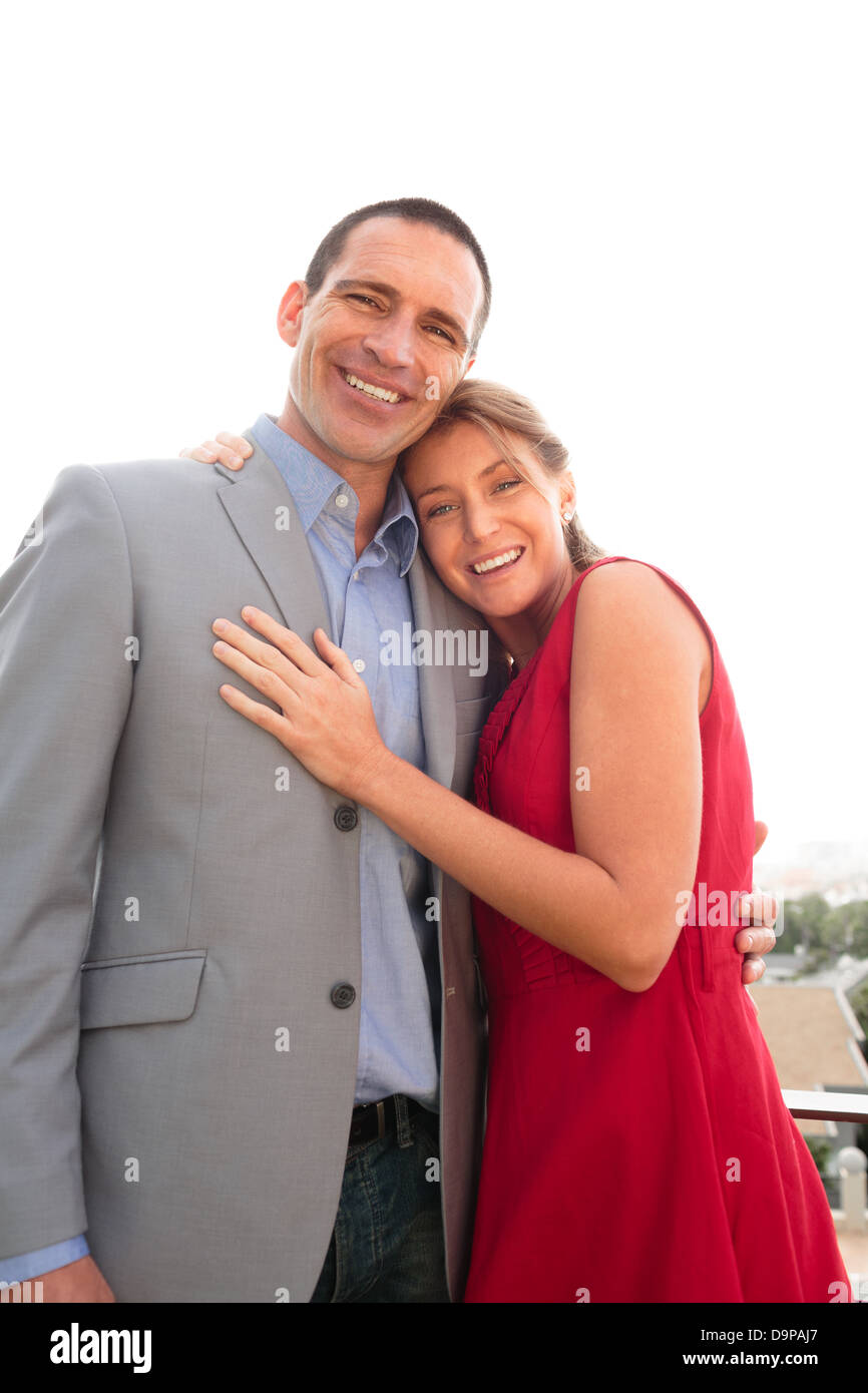 Happy romantic couple cuddling Stock Photo - Alamy