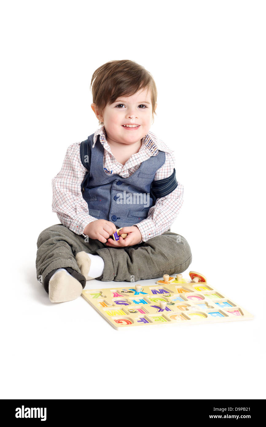 Baby toddler child playing with ABC toys Stock Photo - Alamy