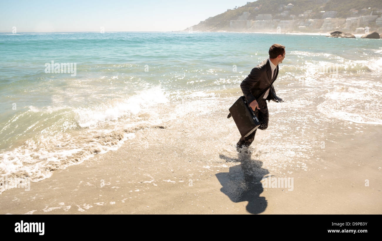 Businessman running out sea hi-res stock photography and images - Alamy