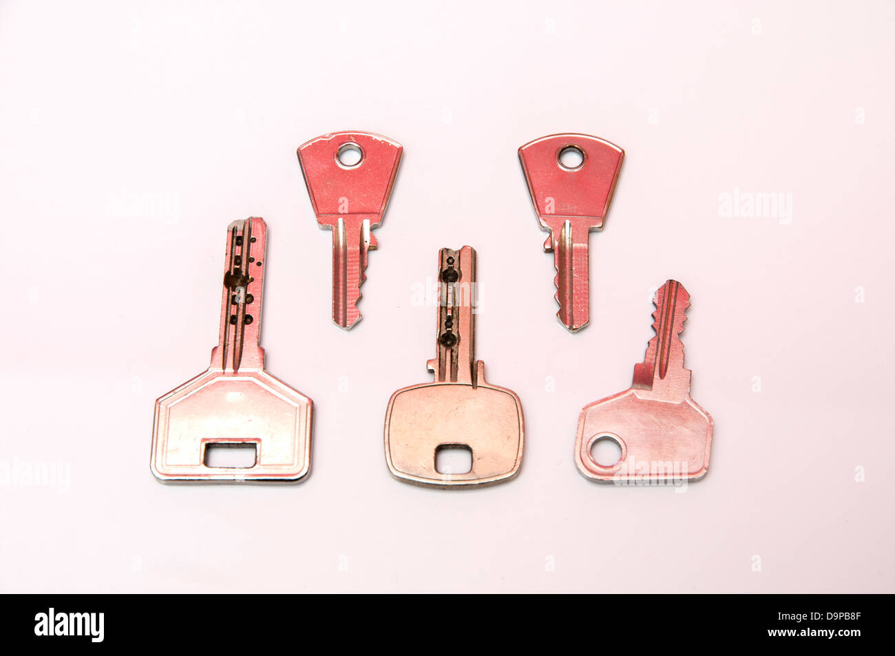 keys of different shapes and sizes to open doors Stock Photo - Alamy