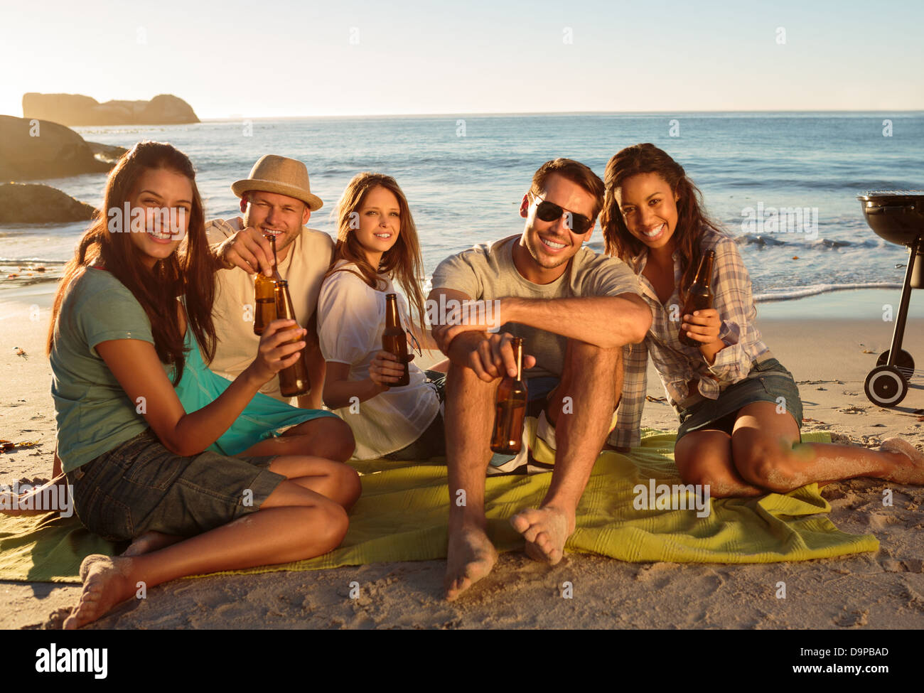 Friends having a barbecue party on the beach Stock Photo - Alamy