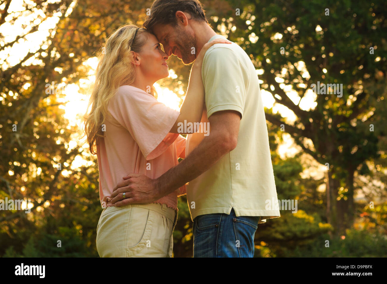 Lovers relaxing in a park Stock Photo - Alamy
