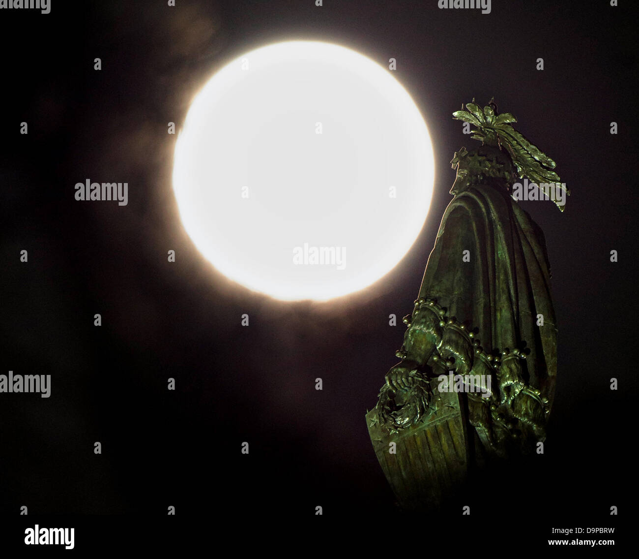 The biggest, brightest moon of 2013 known as the super moon silhouettes ...