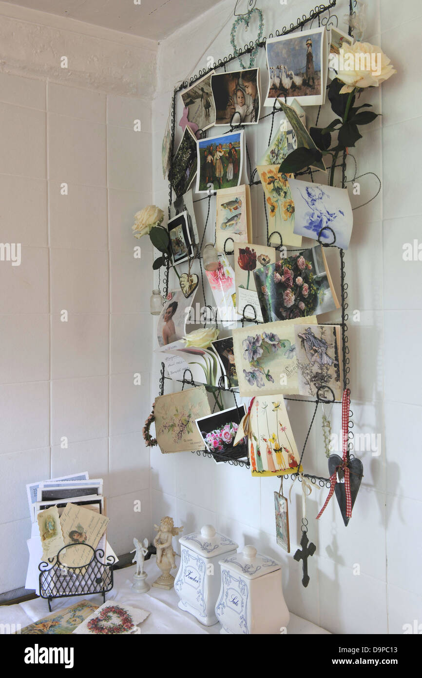 Postcards and pictures at wall Stock Photo - Alamy