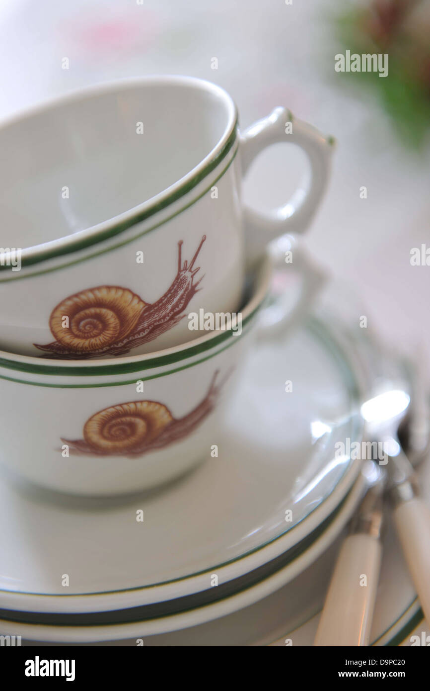 Ornate cups with saucers Stock Photo - Alamy