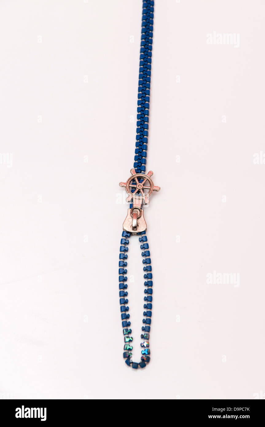 blue zipper with iron ship wheel Stock Photo - Alamy