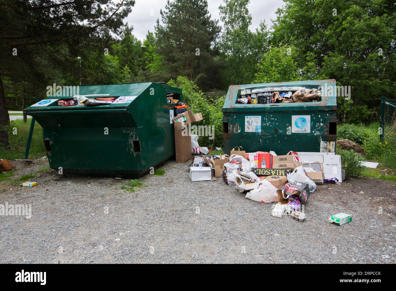 Rubbish outside container Stock Photo - Alamy